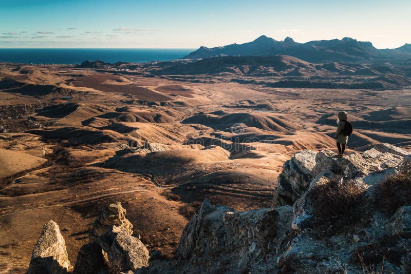 Girl Stands on the Edge of a Cliff Overlooking the Valley Stock Photo ...