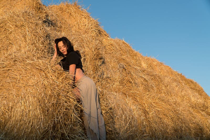 Beautiful Girl Posing on a Haystack. Stock Photo - Image of beautiful ...