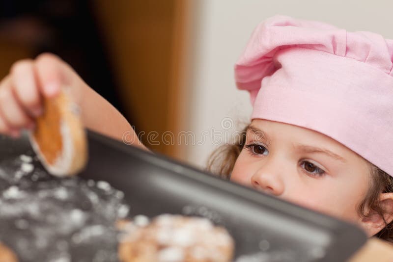 Girl stealing a cookie stock image. Image of homemade - 22345153