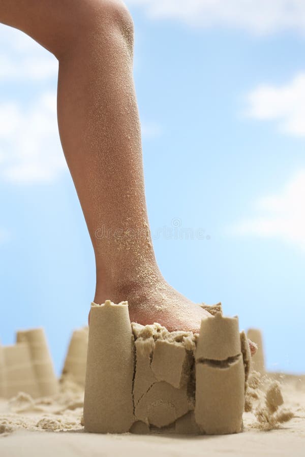 Girl Stepping on Sand Castle Stock Image - Image of mischief ...