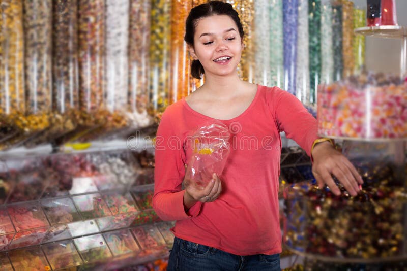 Girl in Store is Picking Up Candies Stock Image - Image of caucasian ...