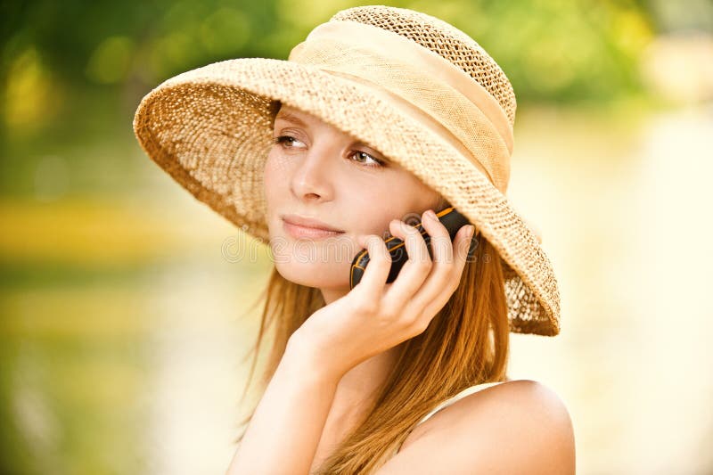 Girl in Straw Hat with Phone Stock Image - Image of blurred, enjoying ...