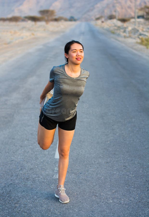 Girl Stretching on the Road before Running Stock Image - Image of ...