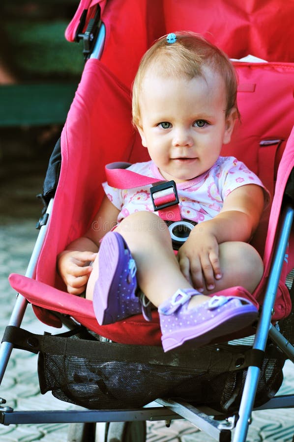 Girl in stroller stock image. Image of outdoors, female - 25913933