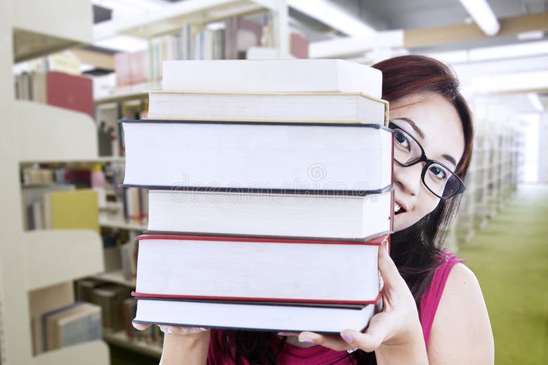 Girl student behind books stock image. Image of attractive - 28065579