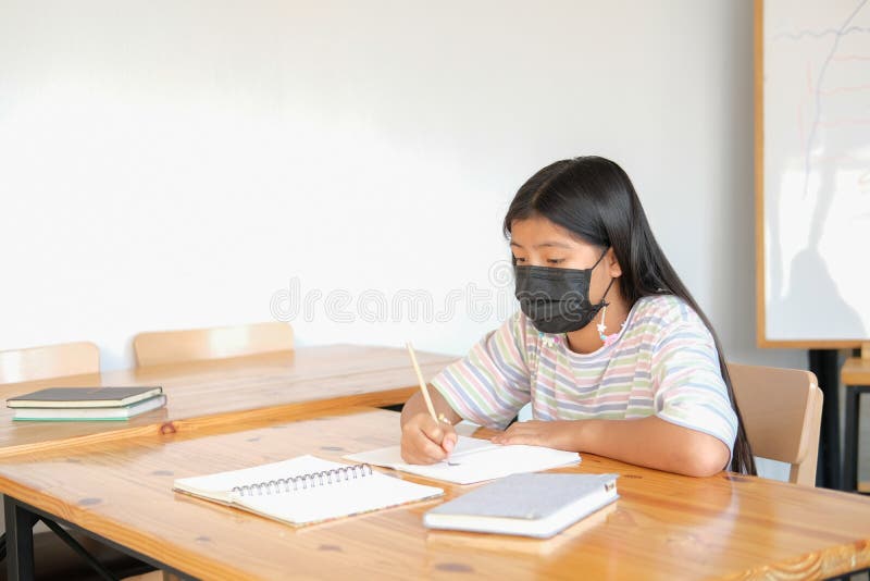 Girl Student Wearing Face Mask Studying Writing Notes Doing Homework ...