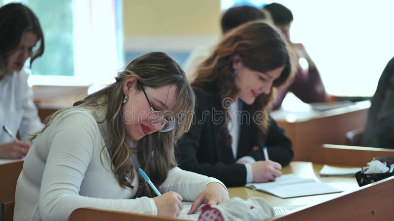 Girl Students Writing Math Formulas in a Notebook. Stock Video - Video ...