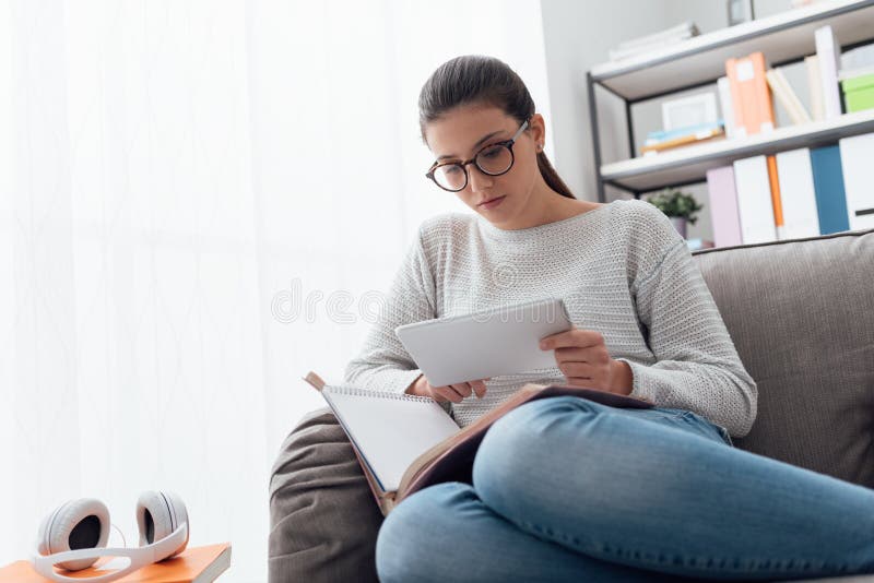 Girl Studying and Connecting with a Tablet Stock Image - Image of book ...