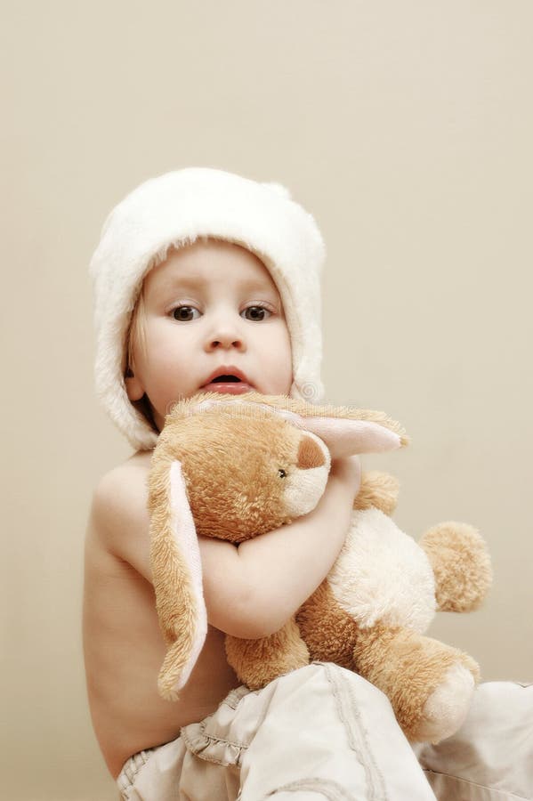 Girl with stuffed rabbit stock image. Image of hold, hugging - 7108511