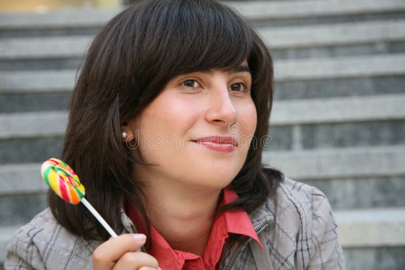 The Girl with a Sugar Candy Stock Image - Image of candy, sweet: 14630627