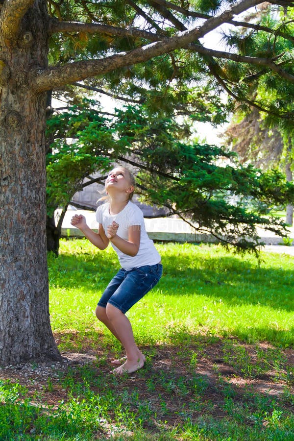 Girl in Summer Try To Jump on Tree Stock Photo - Image of jump, eight ...