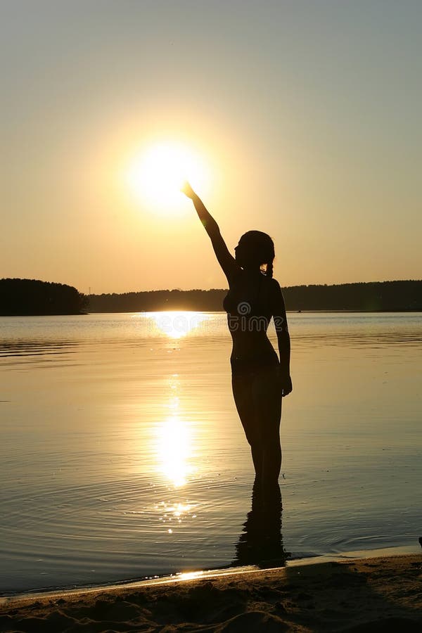 Girl and sun stock image. Image of backlight, beach, people - 147959
