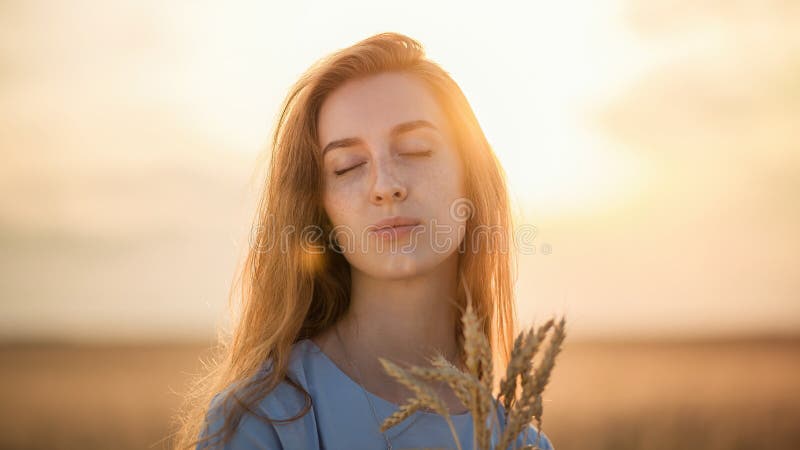Girl in the sun at sunset stock photo. Image of flowers - 81052016