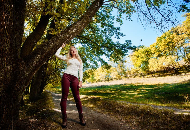 Girl in sunny park stock photo. Image of happy, autumnal - 100019828