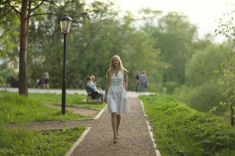 Girl at sunny spring park stock photo. Image of green - 63773236