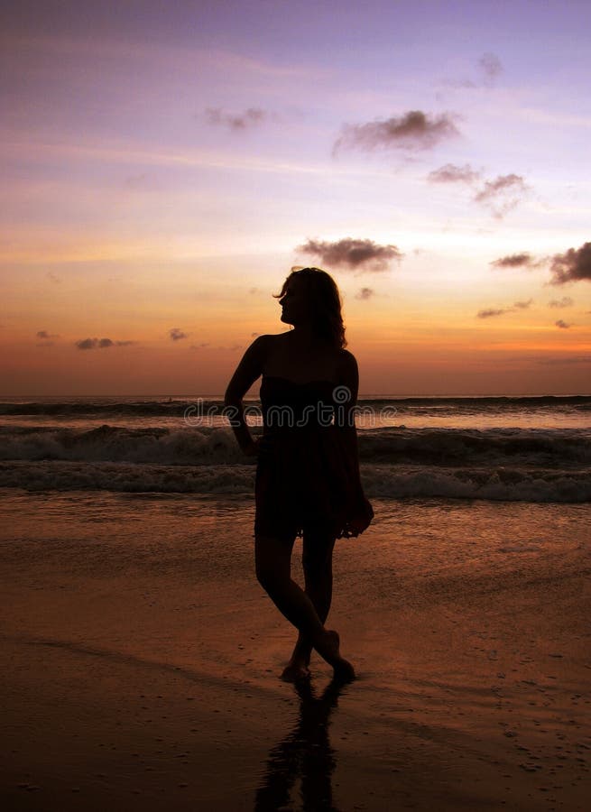 Girl on the sunset beach stock image. Image of cloudy - 38557003