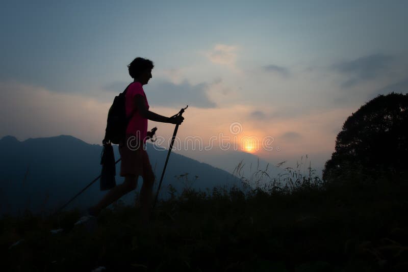 Girl during a Sunset Evening Trek in the Hills Stock Photo - Image of ...