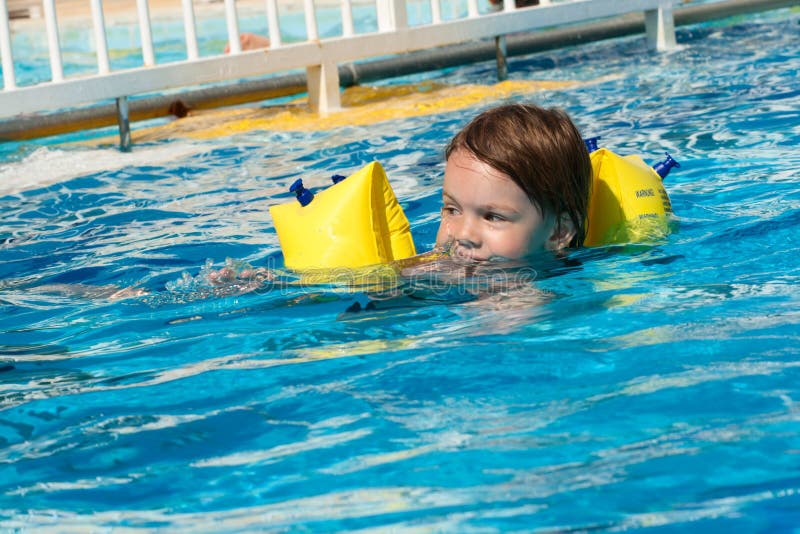 Girl Swimming in Blue Water. Stock Photo - Image of childhood, skin ...