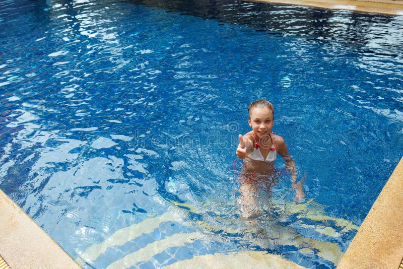 Girl in swimming pool stock photo. Image of outdoor, palm - 55400480