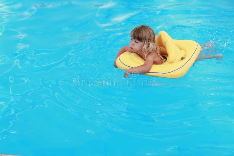 Girl Swims in a Pool with a Circle Stock Photo - Image of outdoors ...