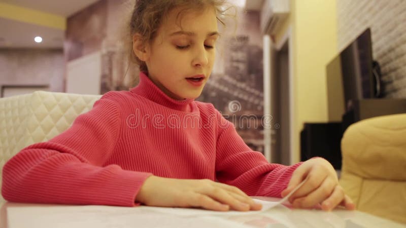 Girl at Table Reading Aloud Text in English with Stock Video - Video of ...