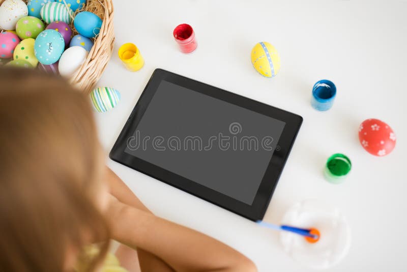 Girl with Tablet Computer, Easter Eggs and Colors Stock Photo - Image ...