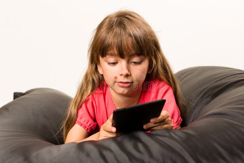 Girl with tablet stock image. Image of reading, children - 41592371