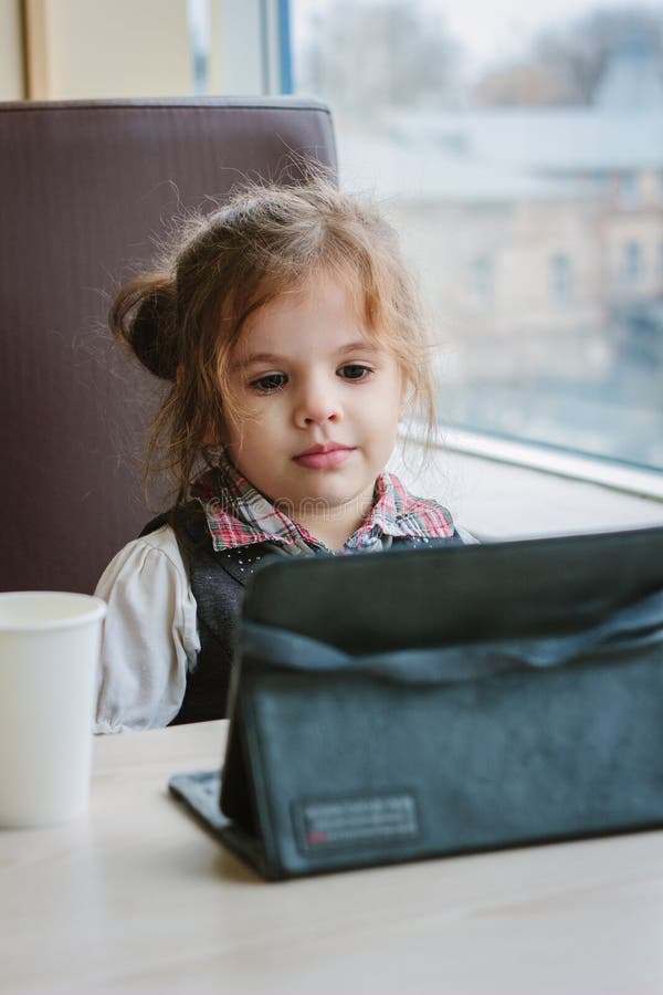 Girl with tablet pc stock photo. Image of adorable, learning - 112694452