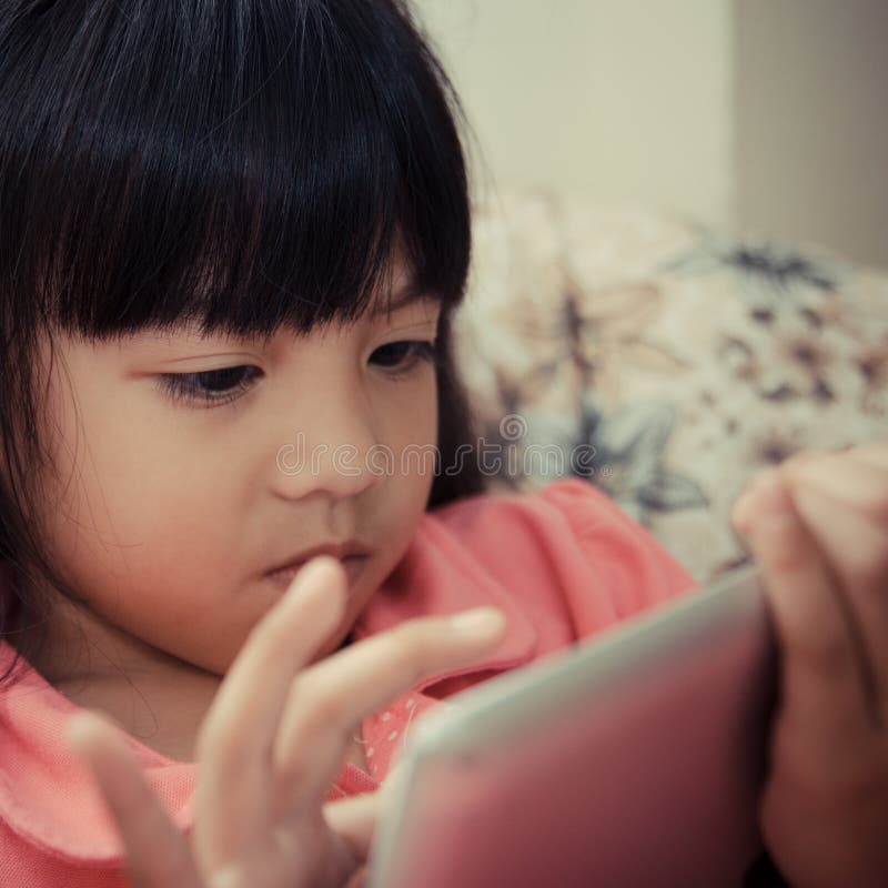Girl with tablet stock image. Image of enjoyment, living - 56265633