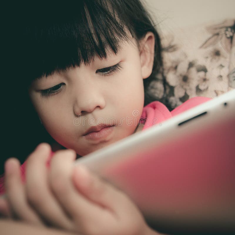 Girl with tablet stock photo. Image of childhood, education - 56266168