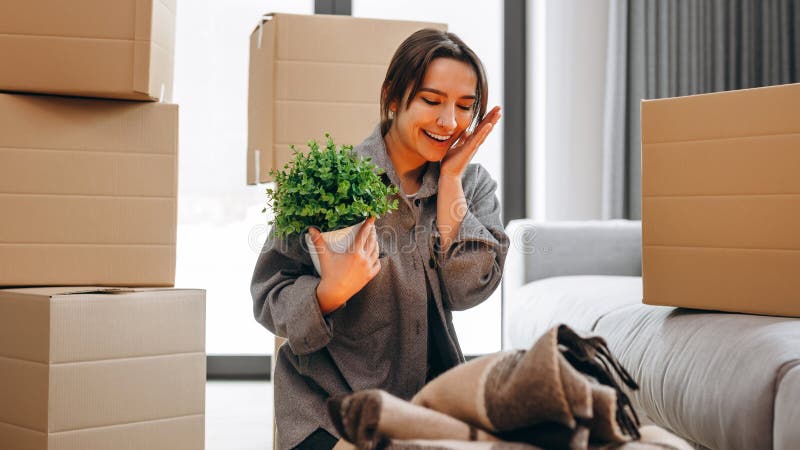 The Girl Takes Things Out of the Box from Which the Light Shines Stock ...