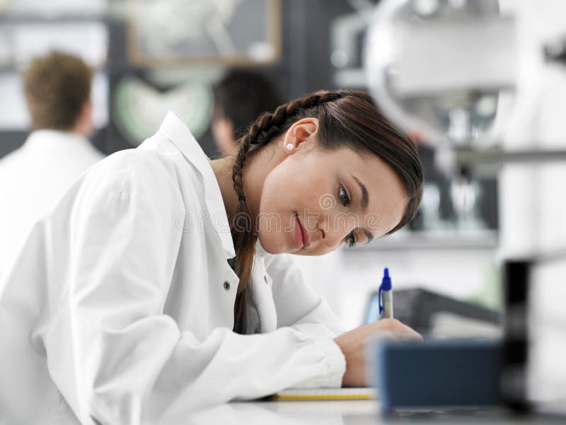 Girl Taking Notes in Science Class Stock Image - Image of education ...