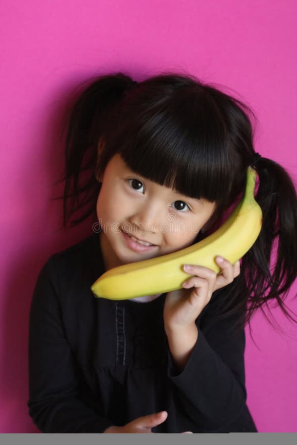 Girl talking on a Banana stock image. Image of happy, funny - 9355123