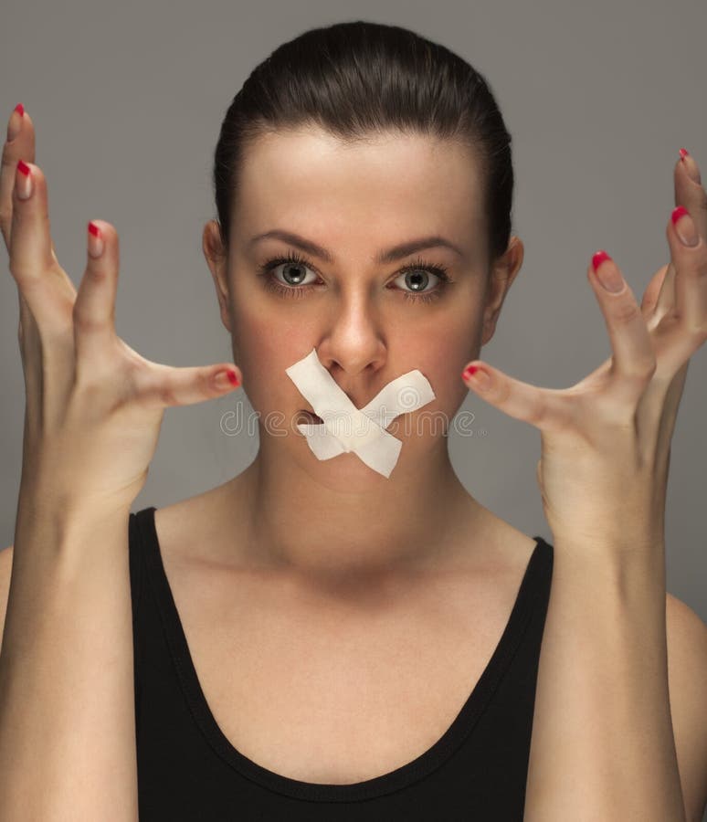 Girl with tape on lips stock image. Image of hopelessness - 69506089