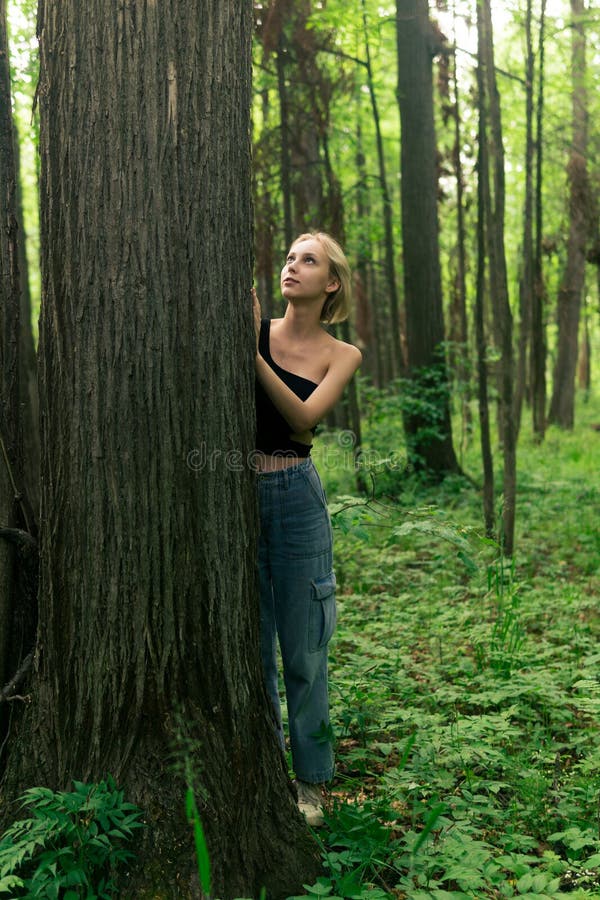 Girl Teenager in a Deciduous Grove Communicates with Trees Stock Image ...