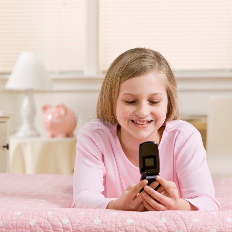 Girl Text Messaging on Cell Phone in Her Bedroom Stock Image - Image of ...