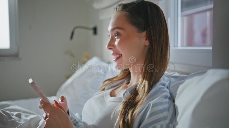 Morning Girl Typing Sms On Cellphone Lying Comfortable Bed Early
