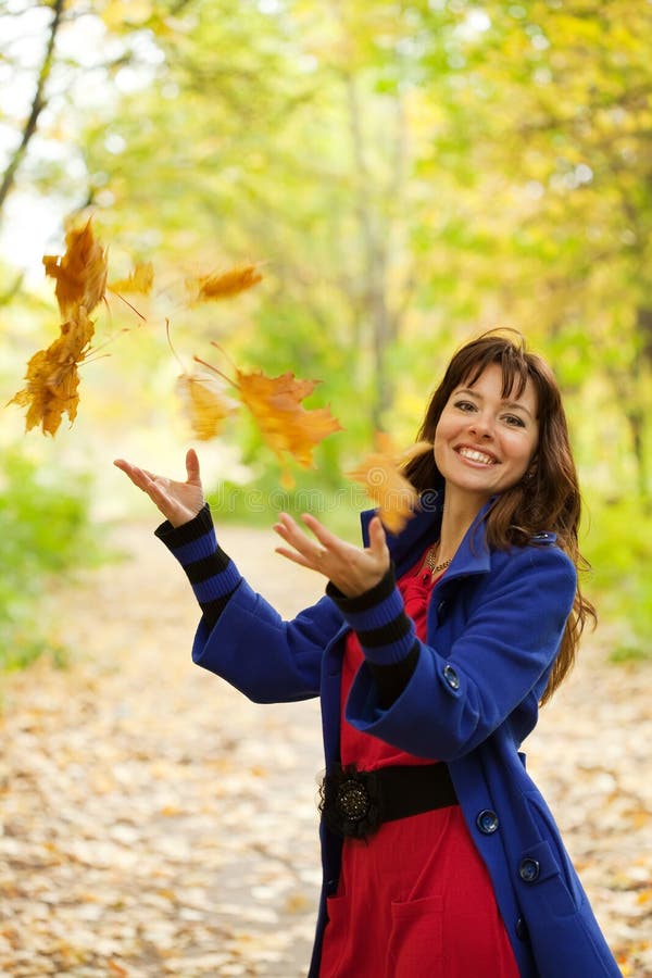 Girl throw up maple leaves stock photo. Image of nature - 21379944