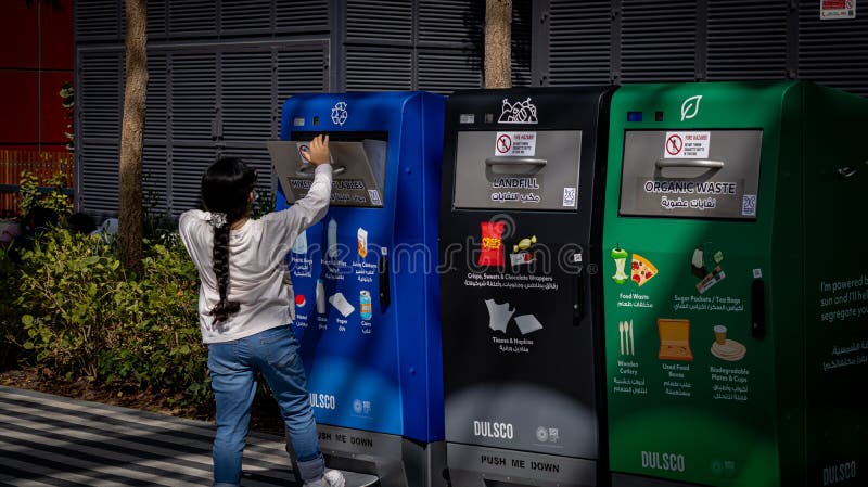 Girl Throwing Garbage into a Dustbin at Expo 2020 Editorial Photography ...