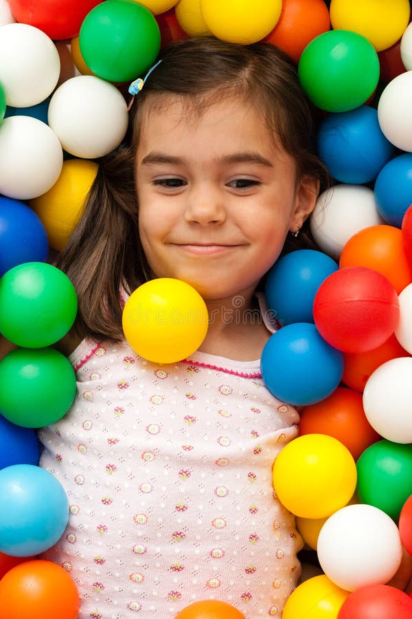 Girl in toy balls stock image. Image of colored, leisure - 42877573