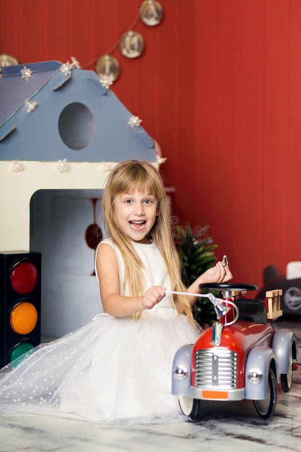 Smiling Girl with a Toy Fire Truck Stock Image - Image of engine ...