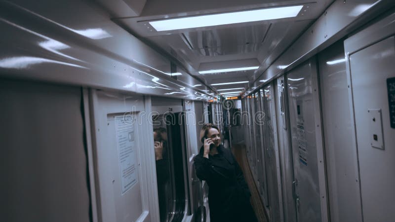 The Girl in the Train Car Uses a Smartphone Stock Video - Video of ...
