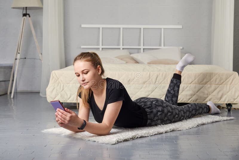 Girl Training at Home. Fit Girl Using Workout Tutorial. Woman Using ...