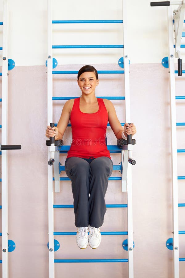 Girl on training machine stock photo. Image of feminine - 20880276