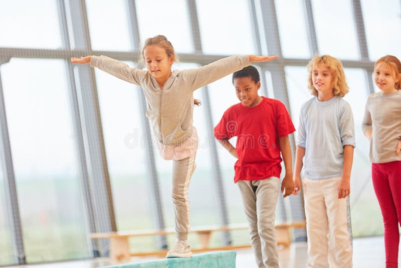 Girl Trains Balance on Balance Beam Stock Image - Image of students ...
