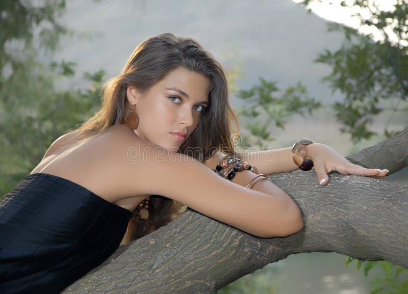 Girl on the tree stock image. Image of dress, loving - 15607341