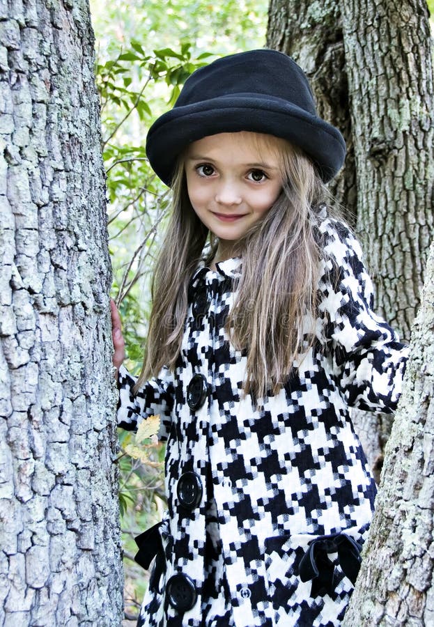 Girl in Tree stock image. Image of coat, lips, close, cheerful - 6934179