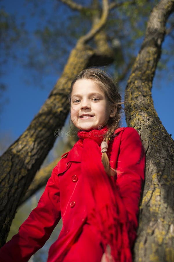 Girl between trees stock image. Image of hand, portrait - 74199217