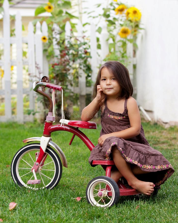 Girl on Tricycle stock photo. Image of cute, adorable - 24807636