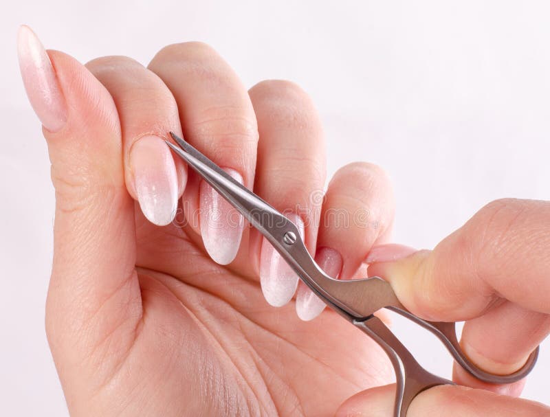 A Girl Trims Her Finger Cuticles with Special Manicure Scissors Stock ...